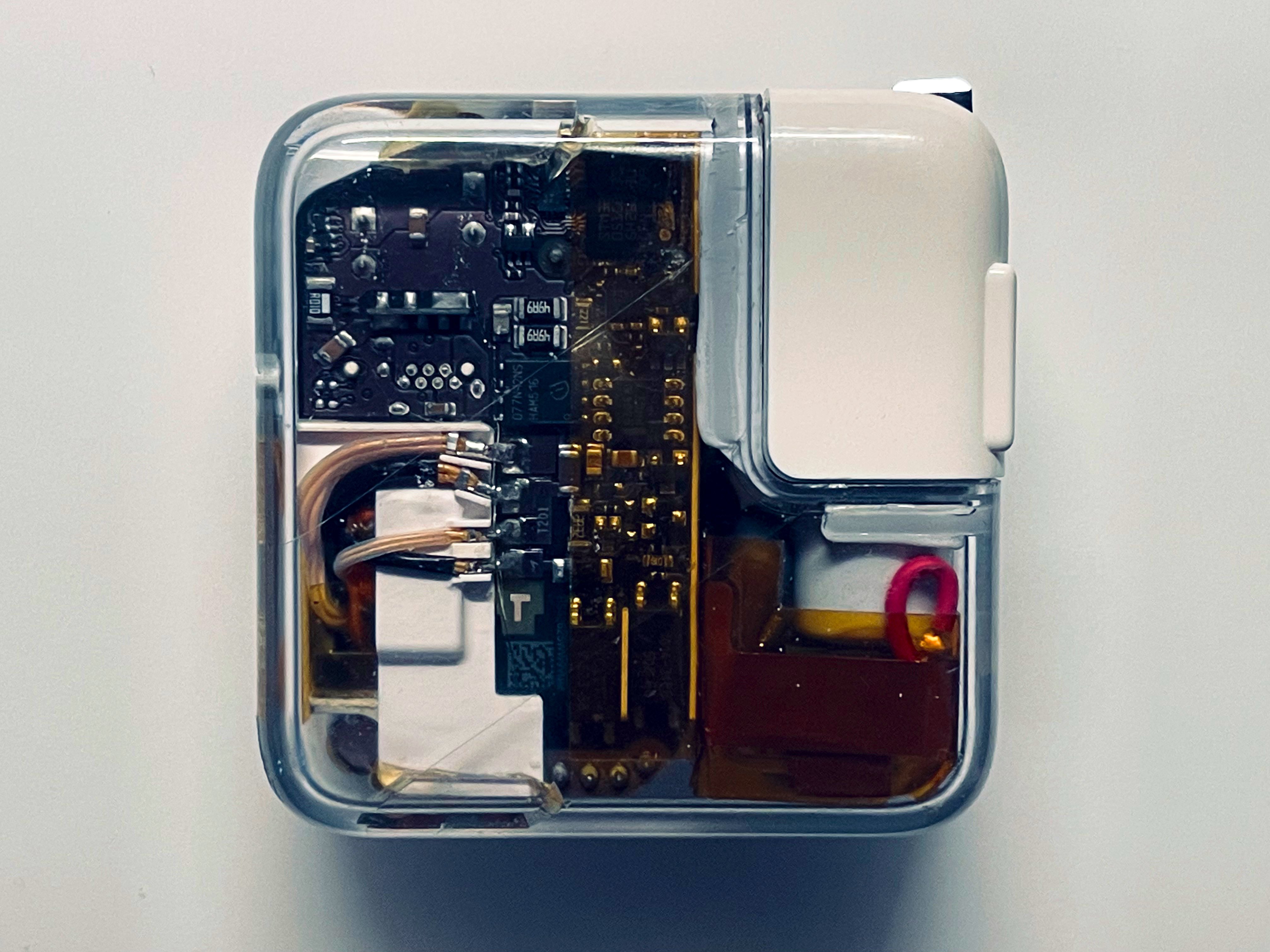 Translucent prototype of Apple AirPods and Apple 29W Charger surfaces ...